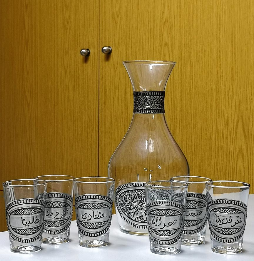 Set fine glass decorated plates of metal in bas-relief jug and cups